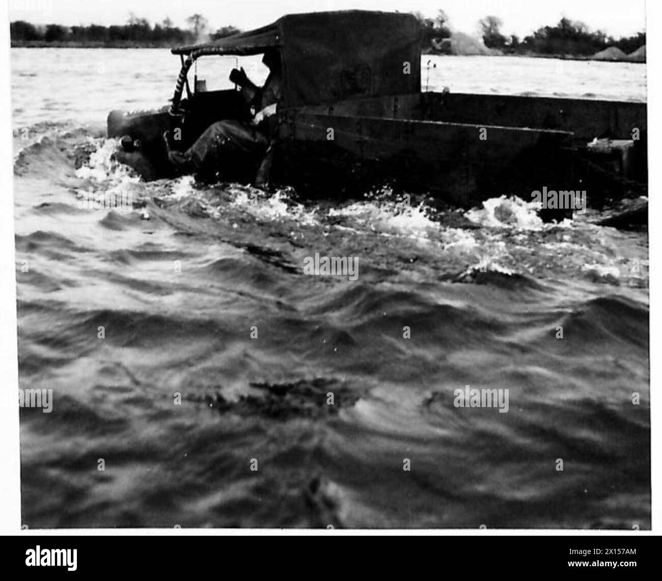 WATERPROOFING ARMY VEHICLES - Army lorries make their way through deep ...