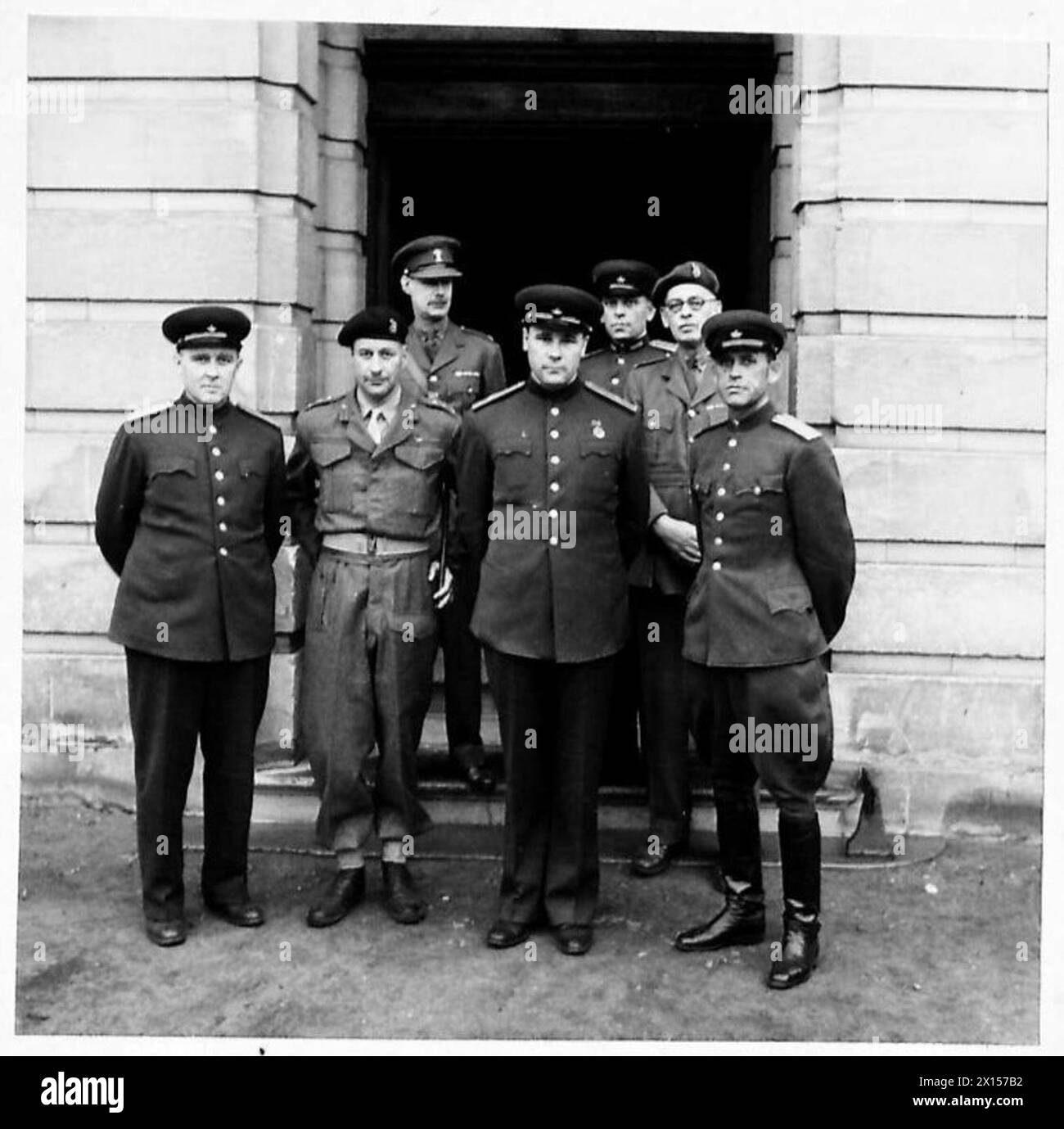 Russian and British officers meet during a visit to the Royal Armoured ...