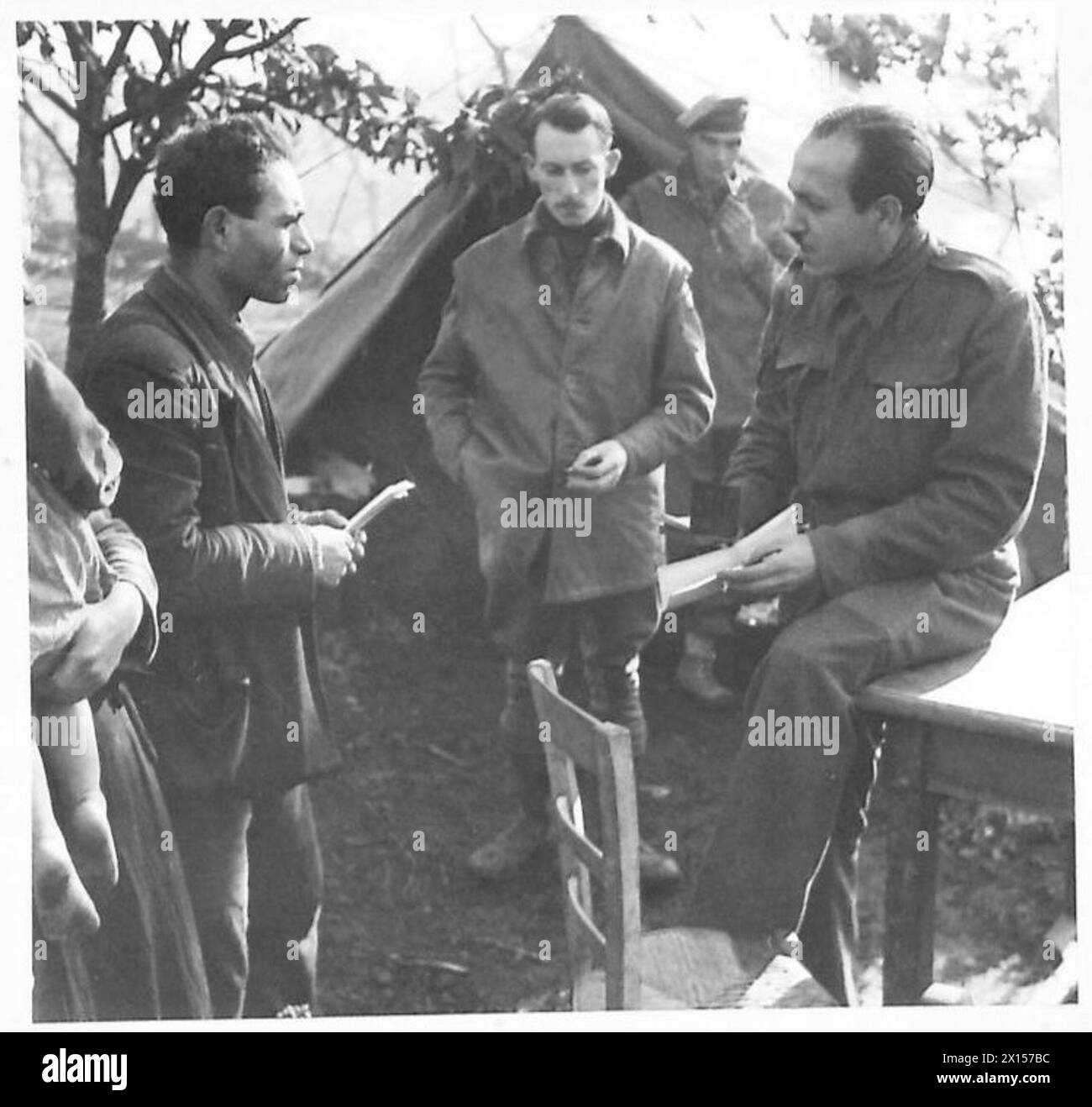 Field Security personnel interrogate Italian civilian refugees ...
