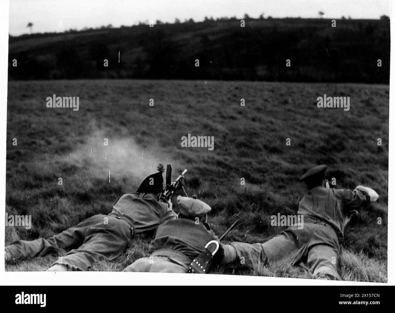 SCHOOL OF BATTLE DRILL - Members of the Battle Drill School firing live Bren ammunition during a ...
