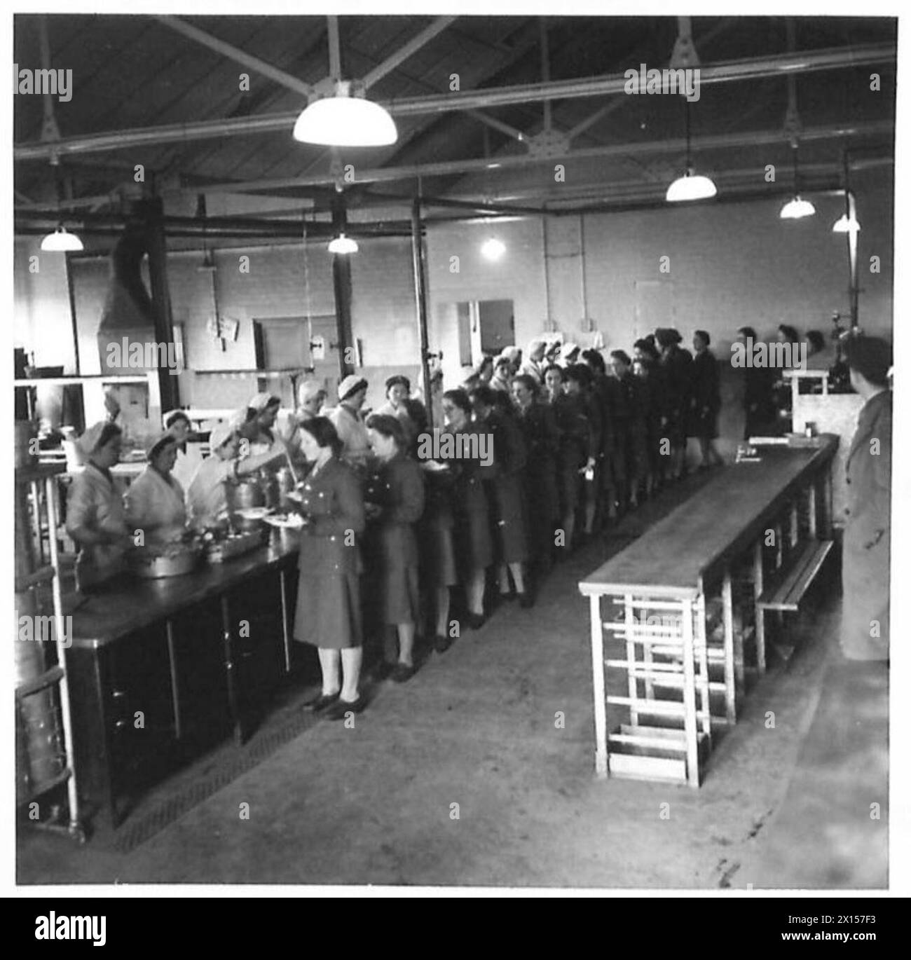 ATS personnel are shown drawing lunch at the cookhouse in the ...