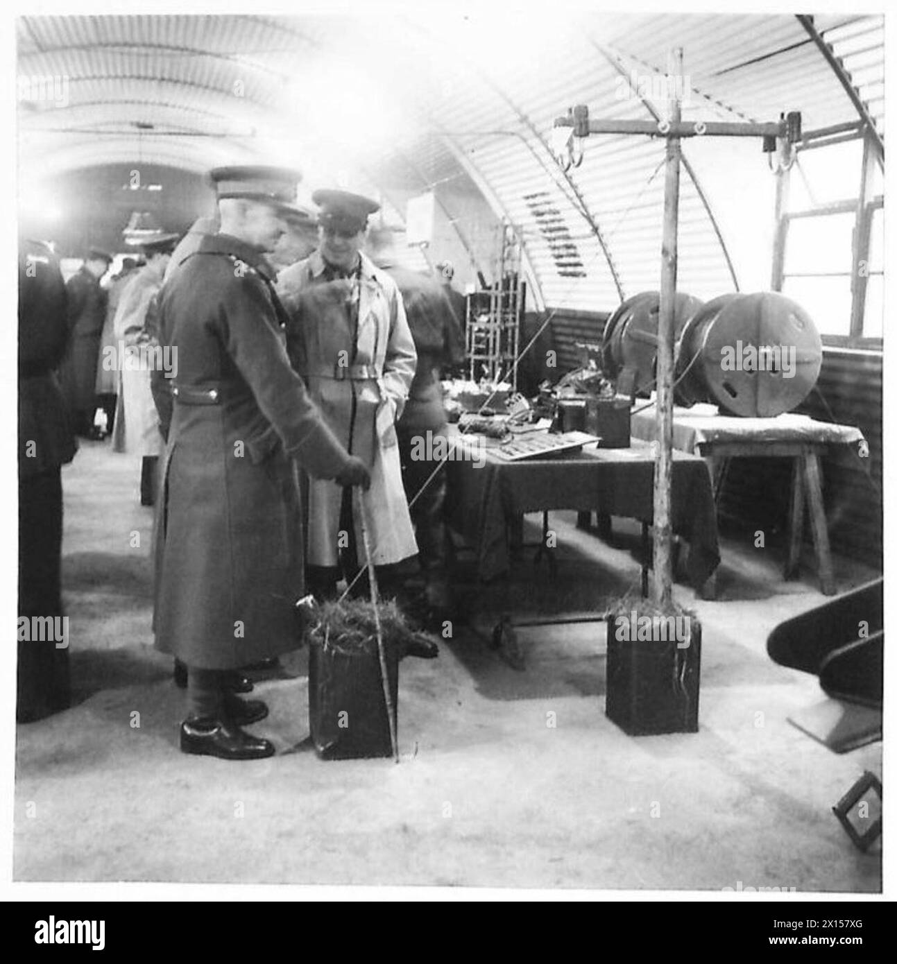 Senior British Army officers inspect a signals exhibition, reviewing ...