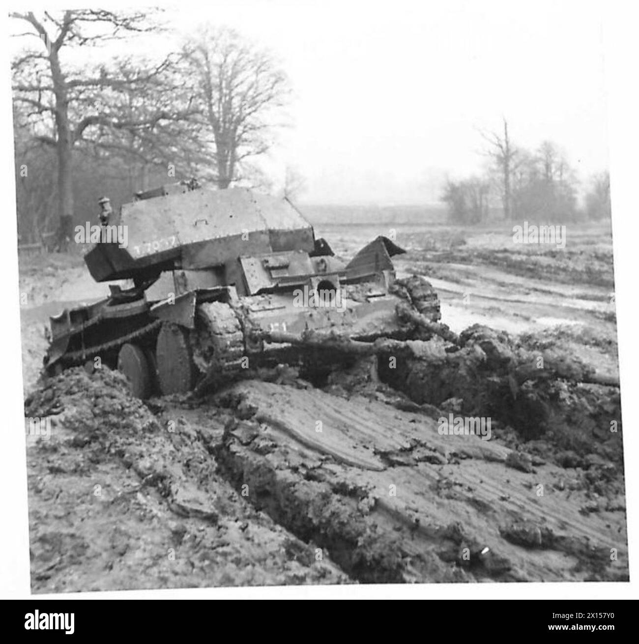 TESTING TANKS IN MUD - A Valentine tank towing a Cruiser Mk. IV through ...