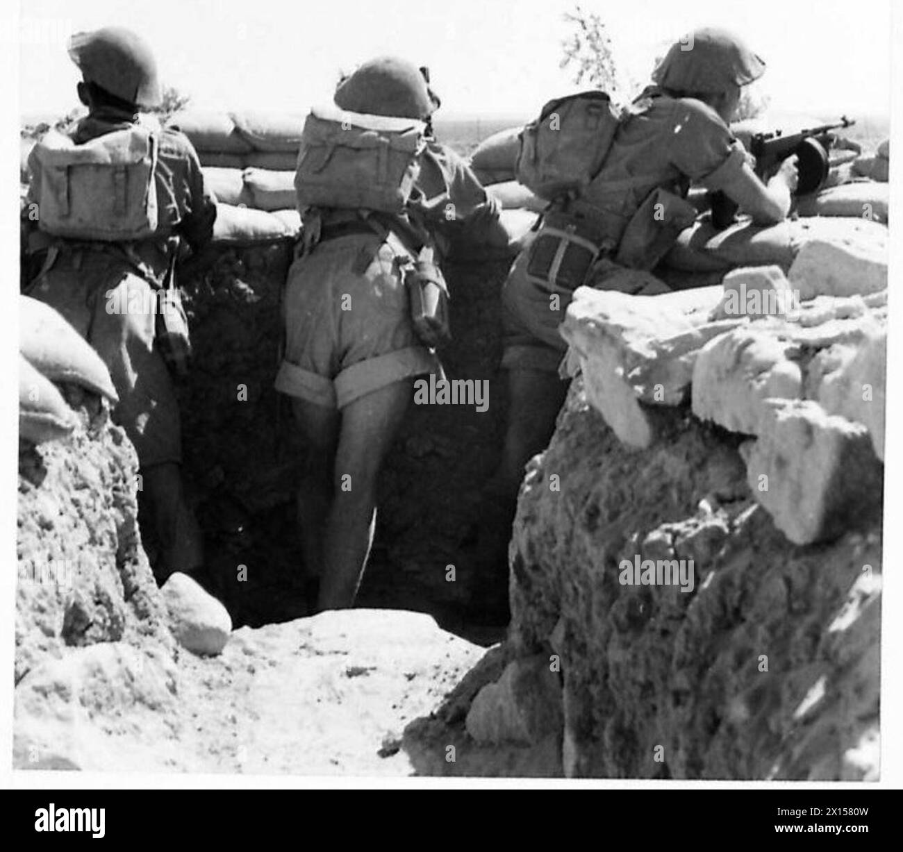 Front line troops observe enemy positions from their defensive ...