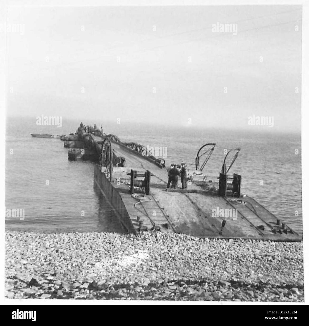 Landing operation showing a shore float ramp deployed on a beach with ...