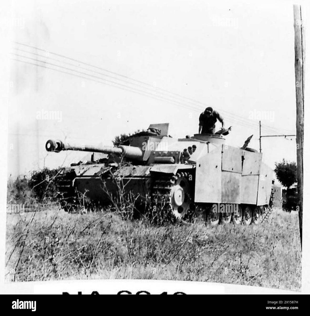A destroyed German Mk 3 tank with a 75mm gun on a P3 KW.111 chassis is ...