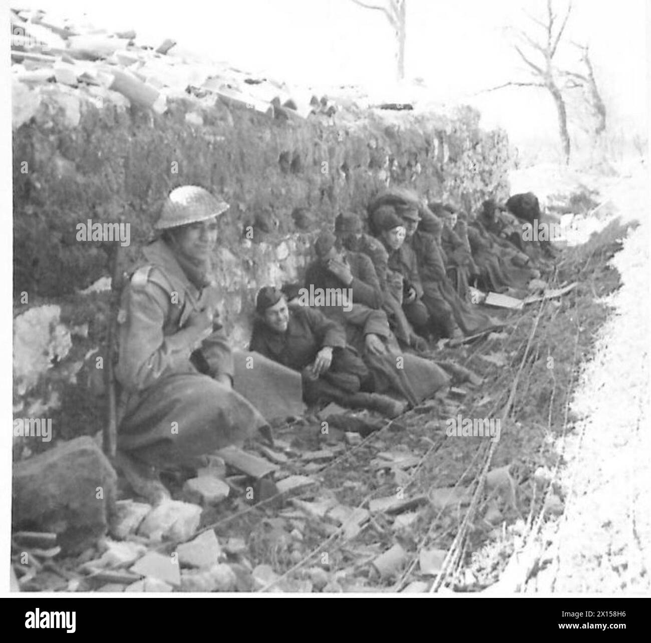 German soldiers captured by Maori troops take shelter in a ditch from ...
