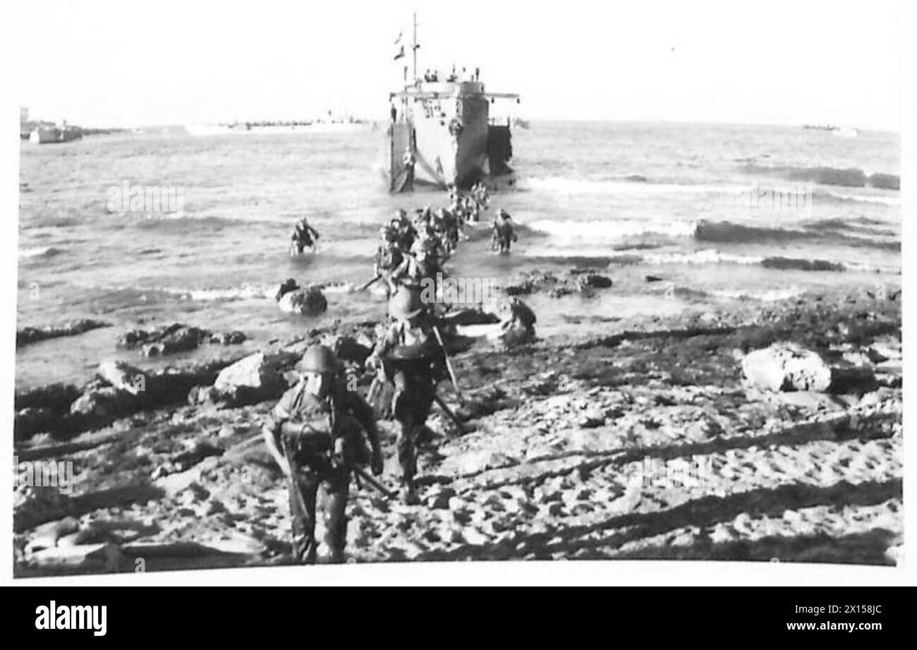 British Army reinforcements are shown disembarking from a Landing Craft ...