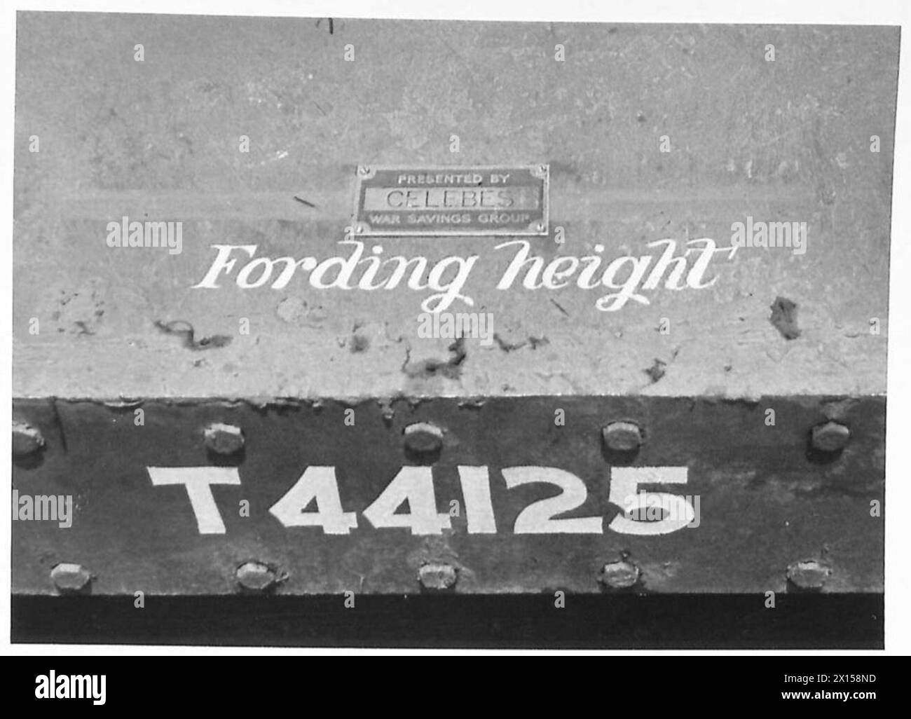 A British Army tank is displayed with a plaque noting it was presented ...
