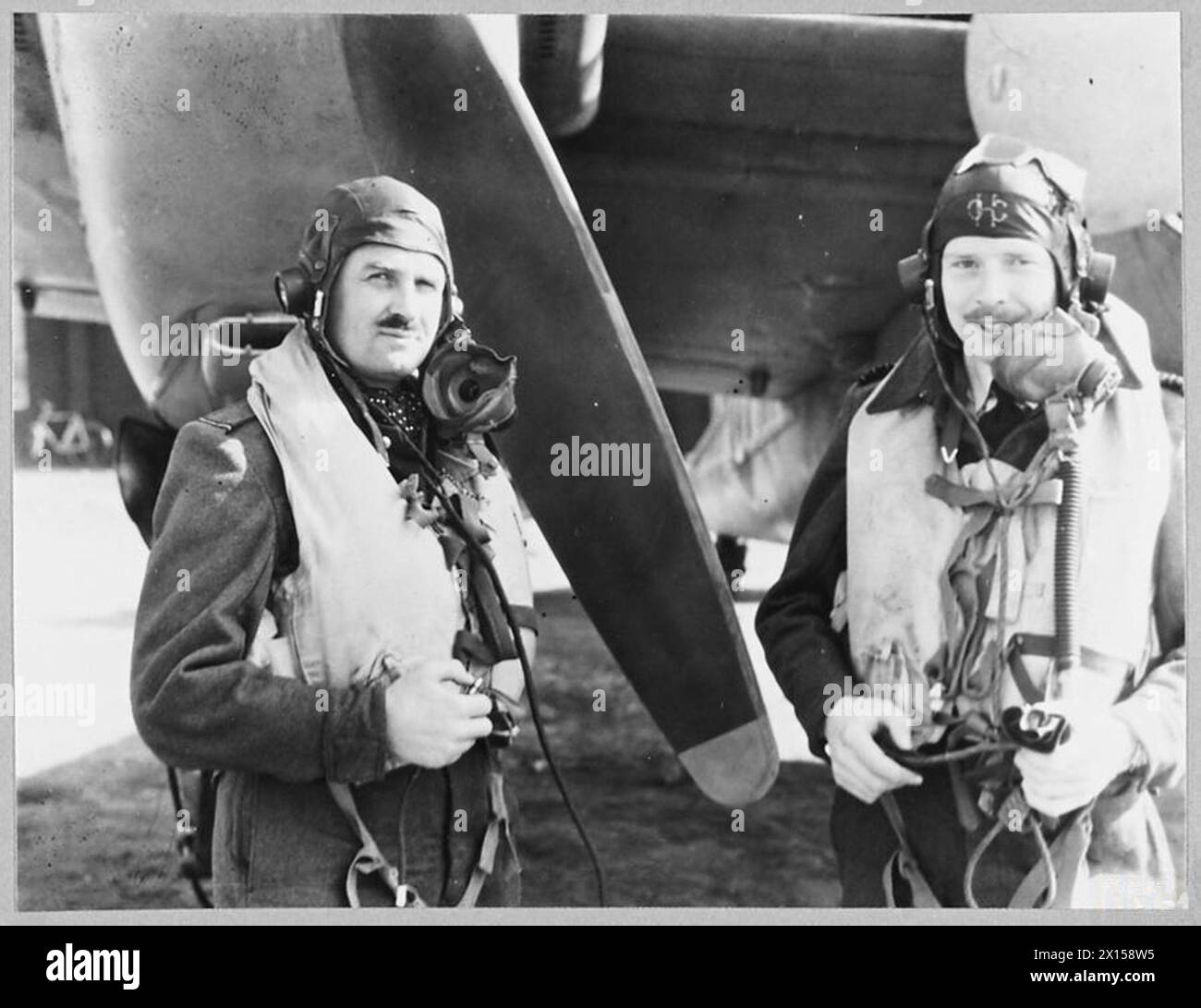 Flying Officer W.F.E. Thomas and Wing Commander G.H. Goodman DFC are ...