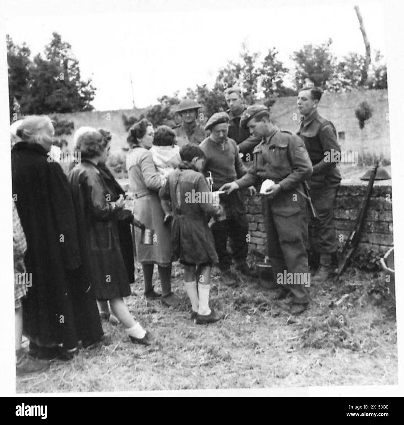 British troops provide food and aid to French refugees under the ...