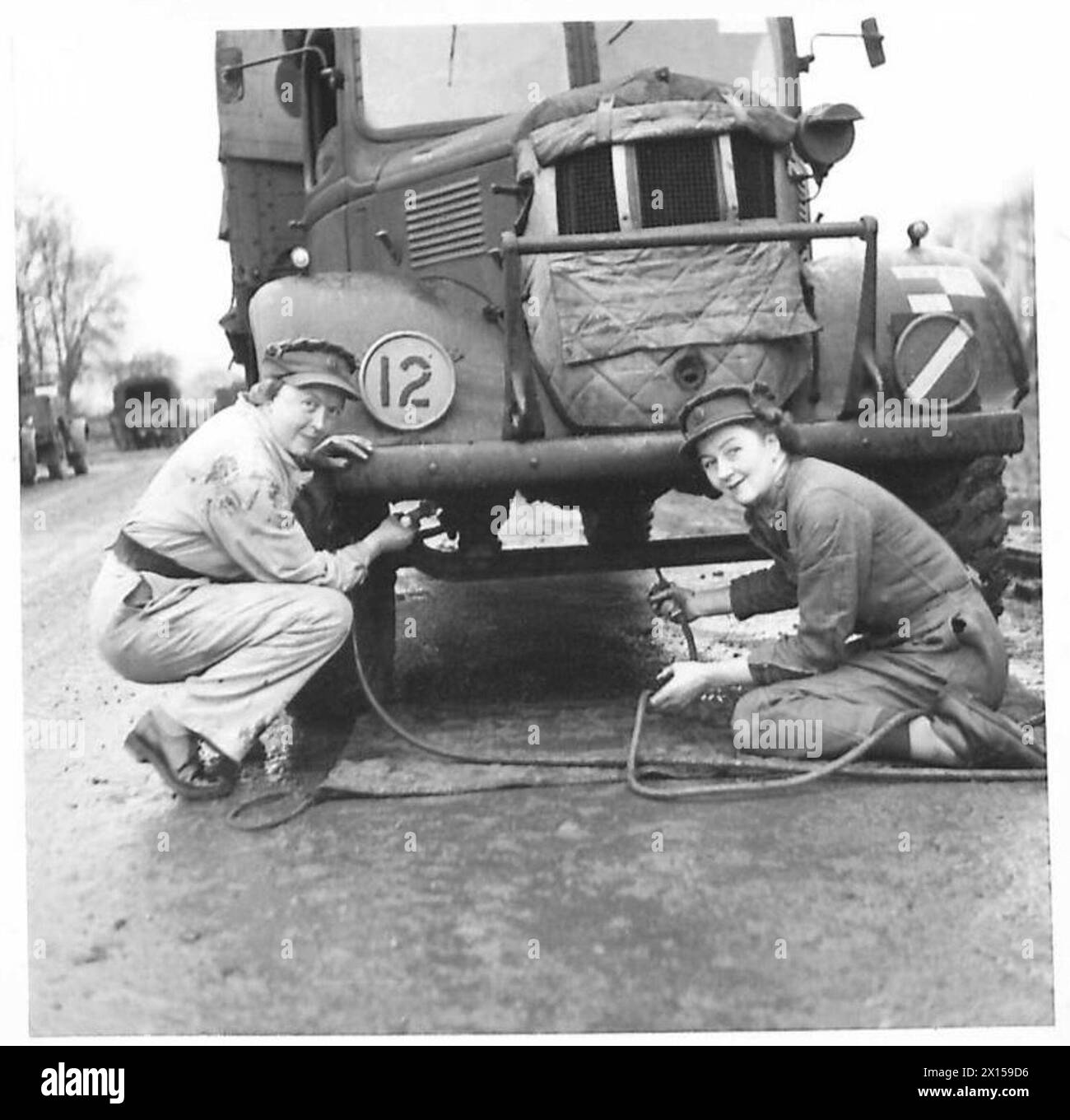 ATS CONVOY DRIVERS AND STORESWOMEN AT WORKS - Two ATS drivers at work ...