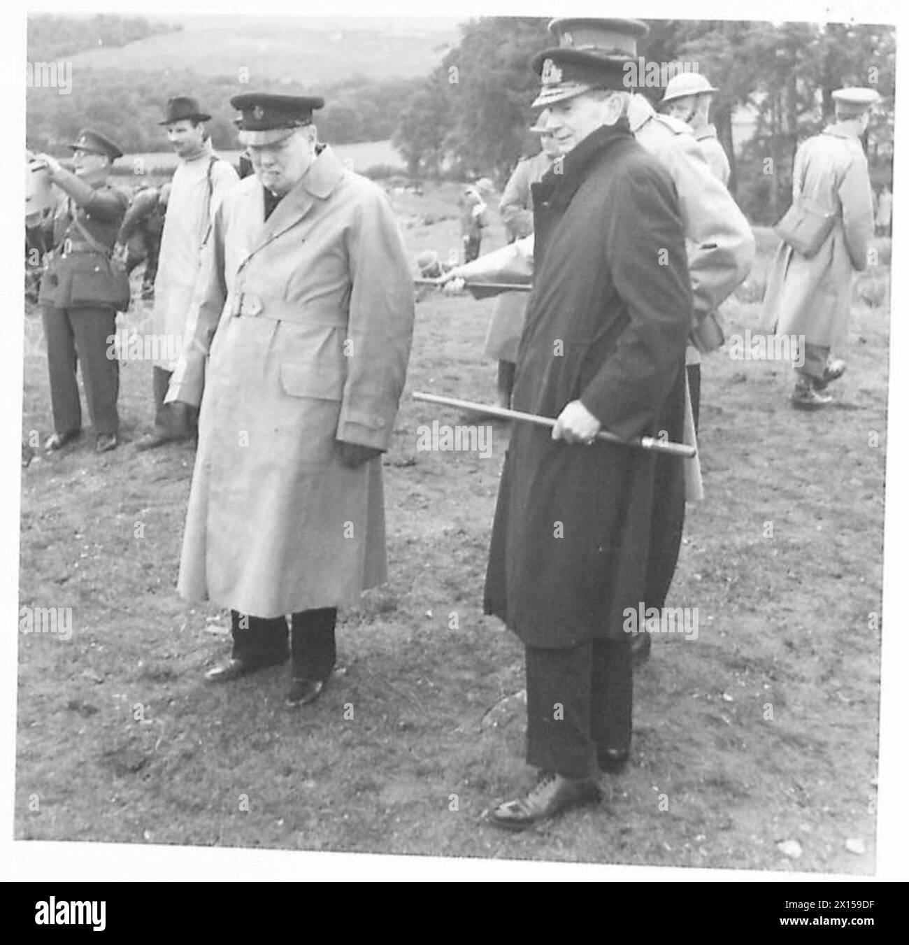 Mr. Churchill and Admiral Sir Roger Keyes observe the progress of a ...