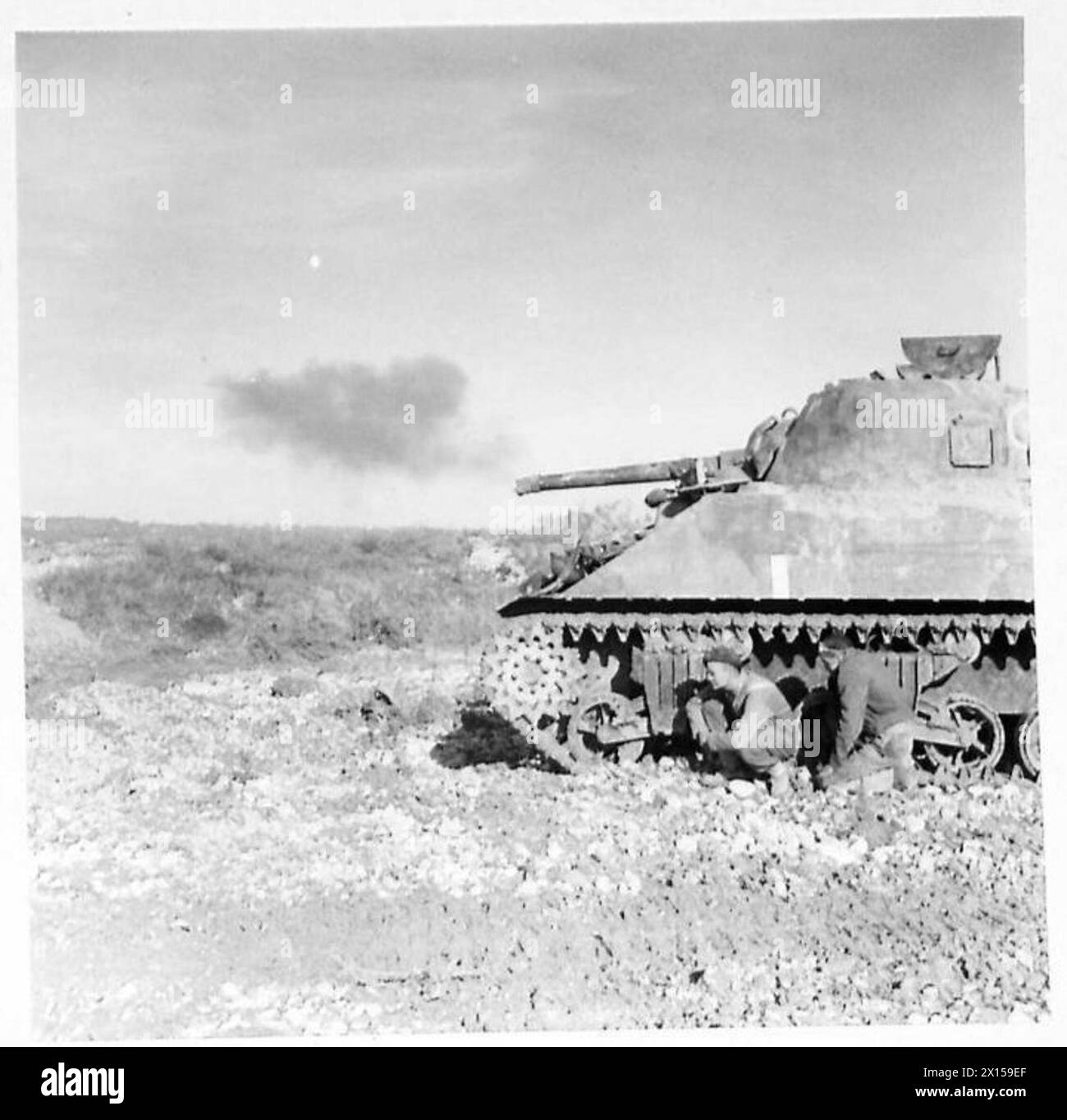 A Sherman tank is positioned on the gravel bed of the Sangro River in ...