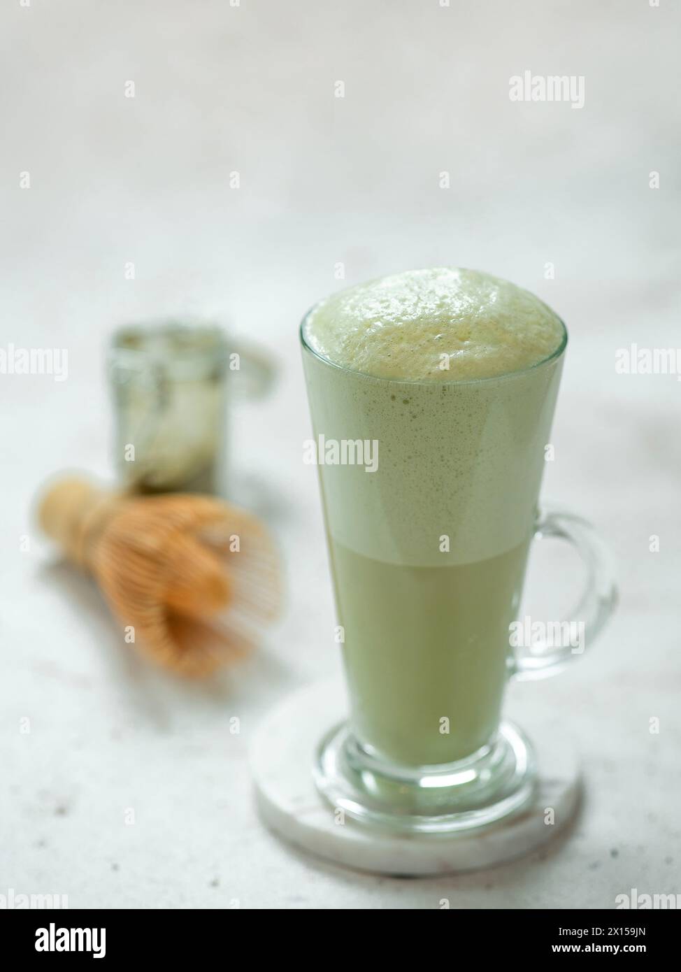 Perfect green matcha tea latte with foam. Matcha green tea latte in ...
