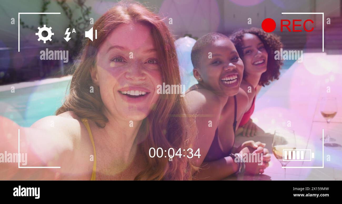 Image of image over happy diverse female friends in pool taking self ...