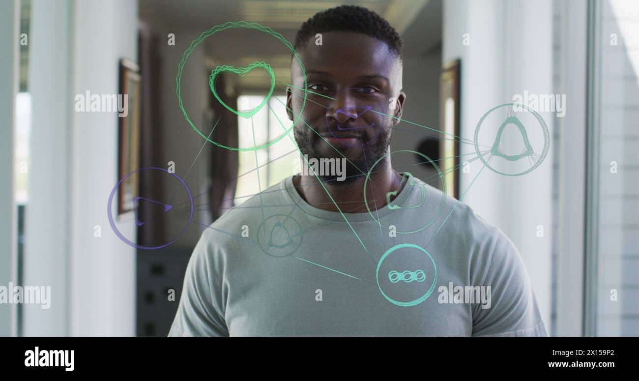 Image of connections with icons over african american man smiling at ...