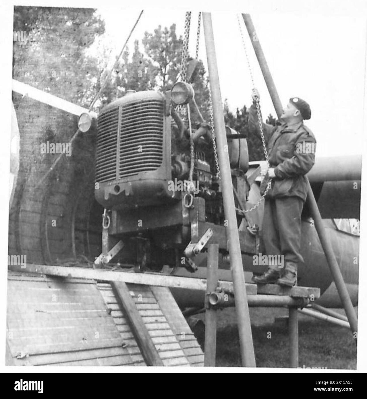 Personnel load and unload a D.40 tractor into a Horsa glider for ...