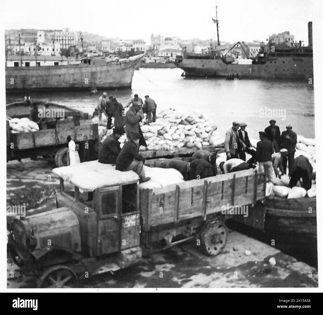 Unloading sacks Black and White Stock Photos & Images - Alamy