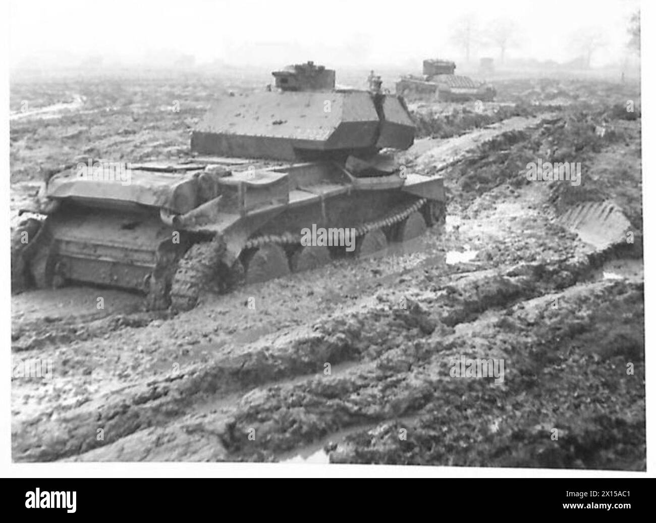 TESTING TANKS IN MUD - A Valentine tank towing a Cruiser Mk. IV through ...
