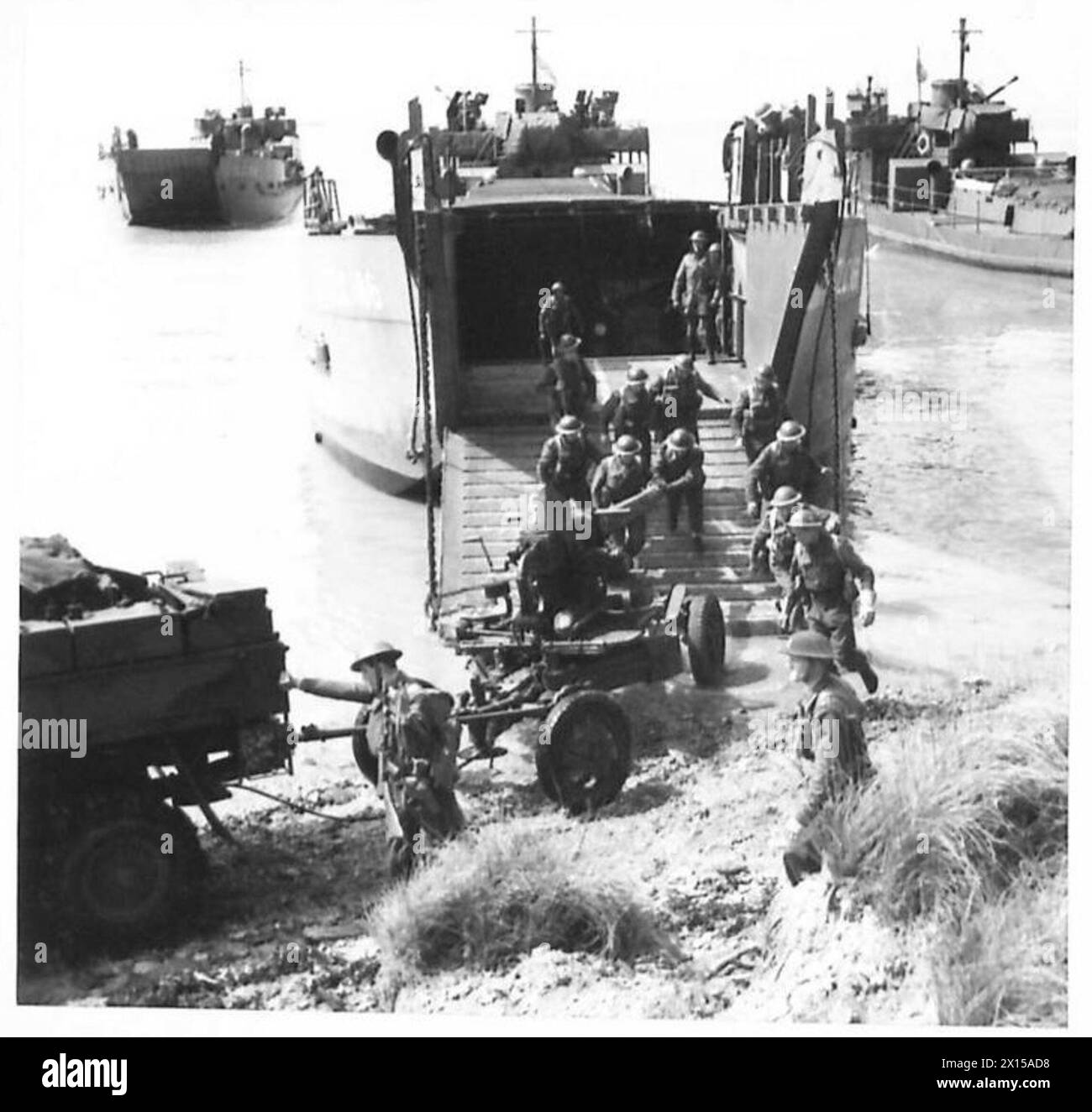 Tank landing craft deploy troops, guns, ammunition, and Bren carriers ...