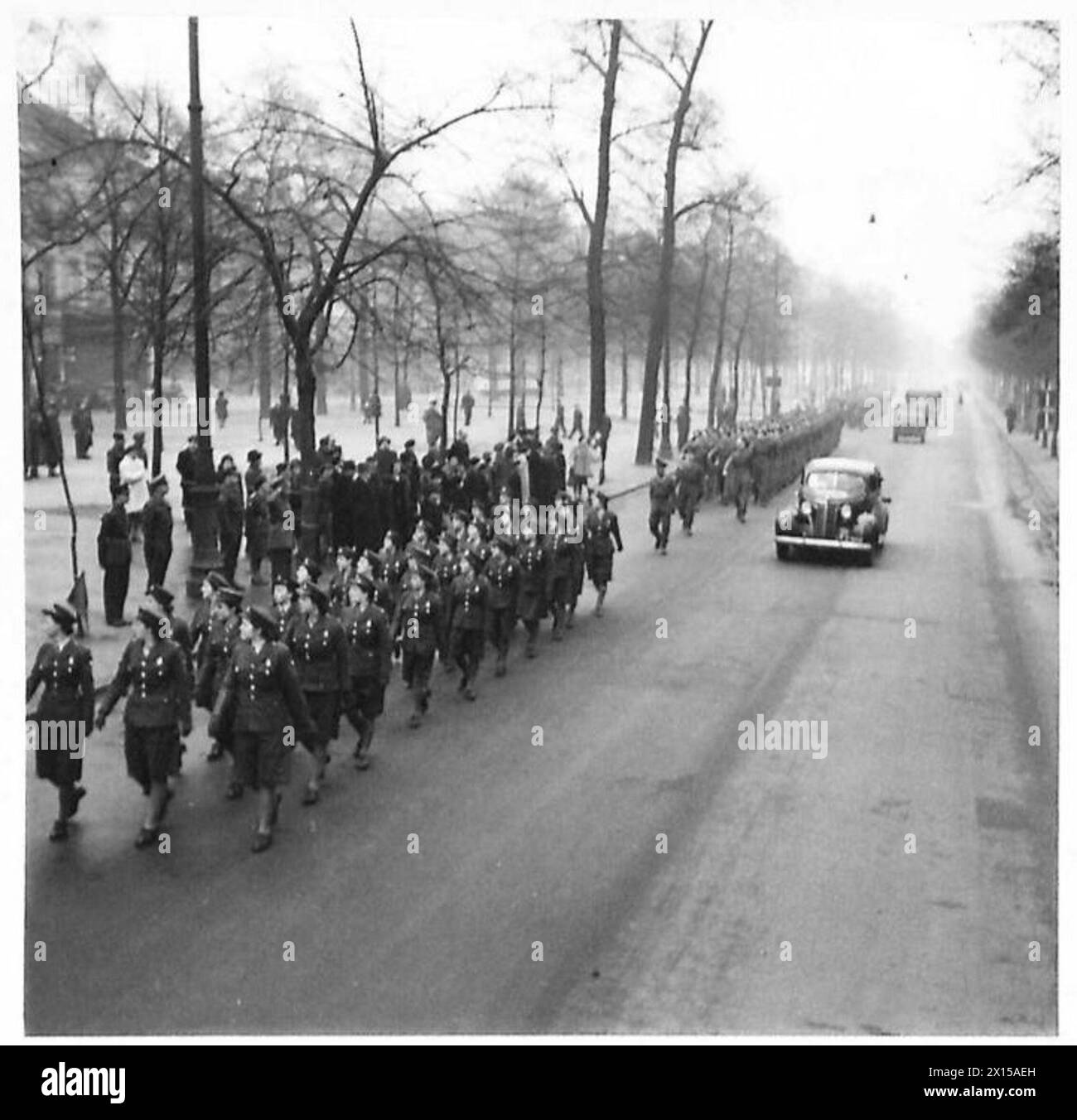 Members of the Auxiliary Territorial Service take the salute during a ...