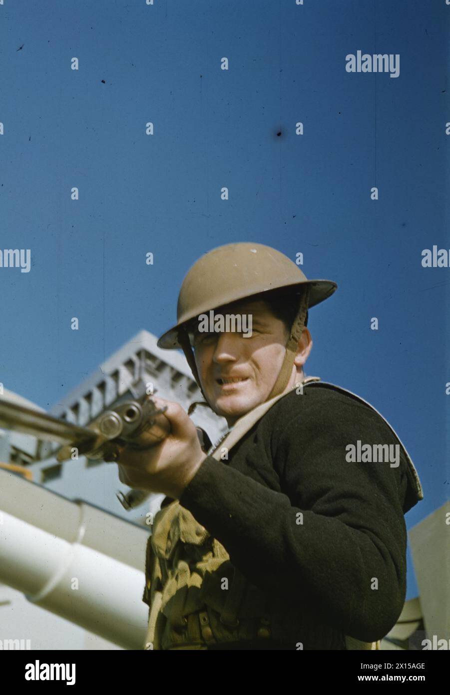 ON BOARD A BATTLESHIP, NOVEMBER 1942 - A naval rating with rifle and ...