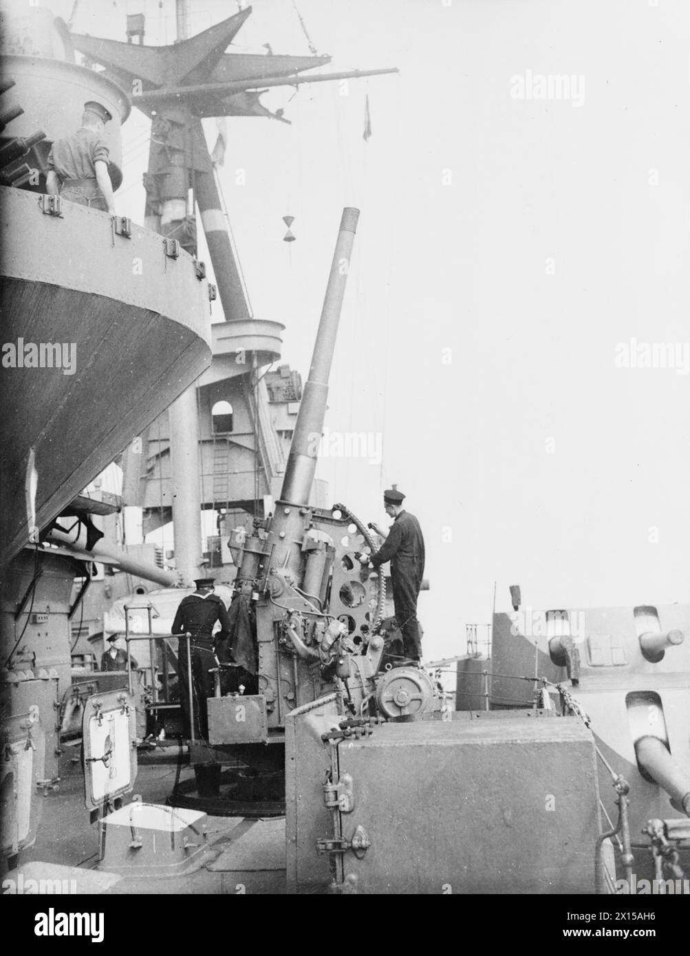 ON BOARD HMS RODNEY. 1940, AT SEA, ON BOARD THE BATTLESHIP HMS RODNEY. - Cleaning a 4.7 inch gun ...