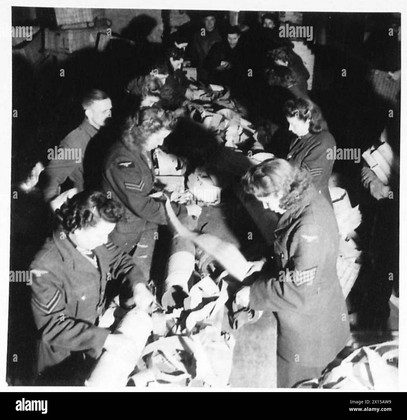 SALVAGE - Sorting and baling scrap paper, the civilian girls are ...