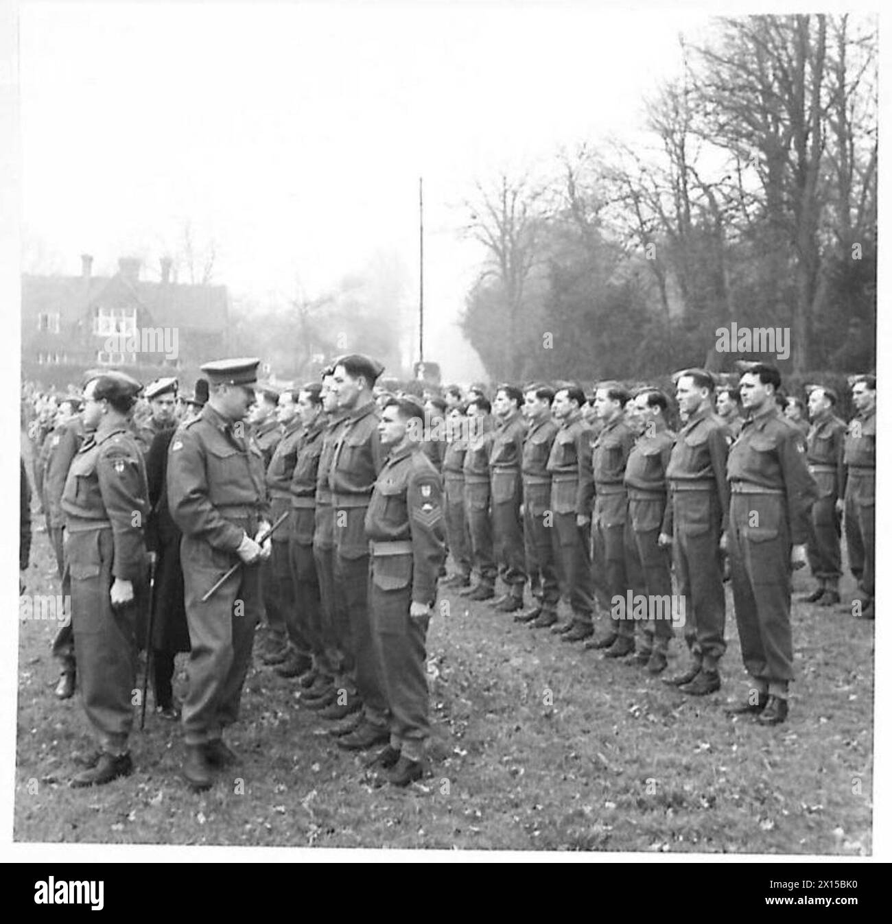 Lieutenant General N.M. Ritchie and Mr. D.J. Davies inspect troops of ...