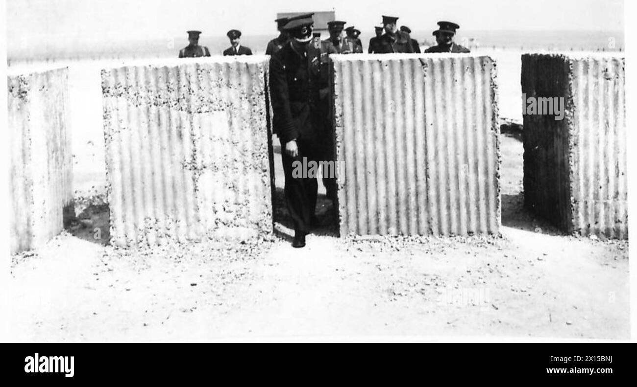 THE DUKE OF KENT INSPECTS DEFENCES - H.R.H. passing a concrete anti ...