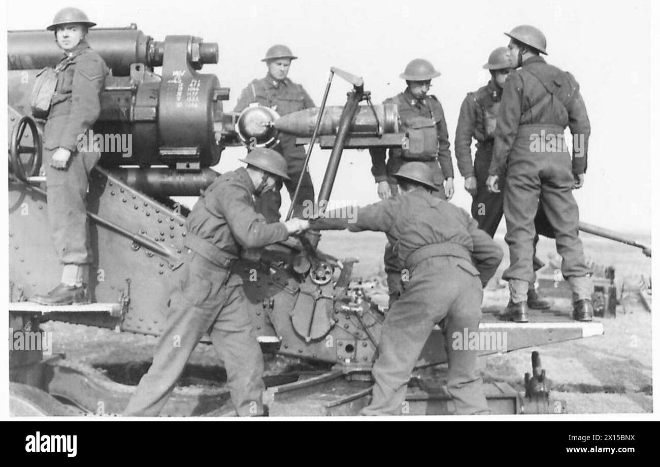 THE BIG GUNS SPEAK - The shell on the cradle being hoisted into ...