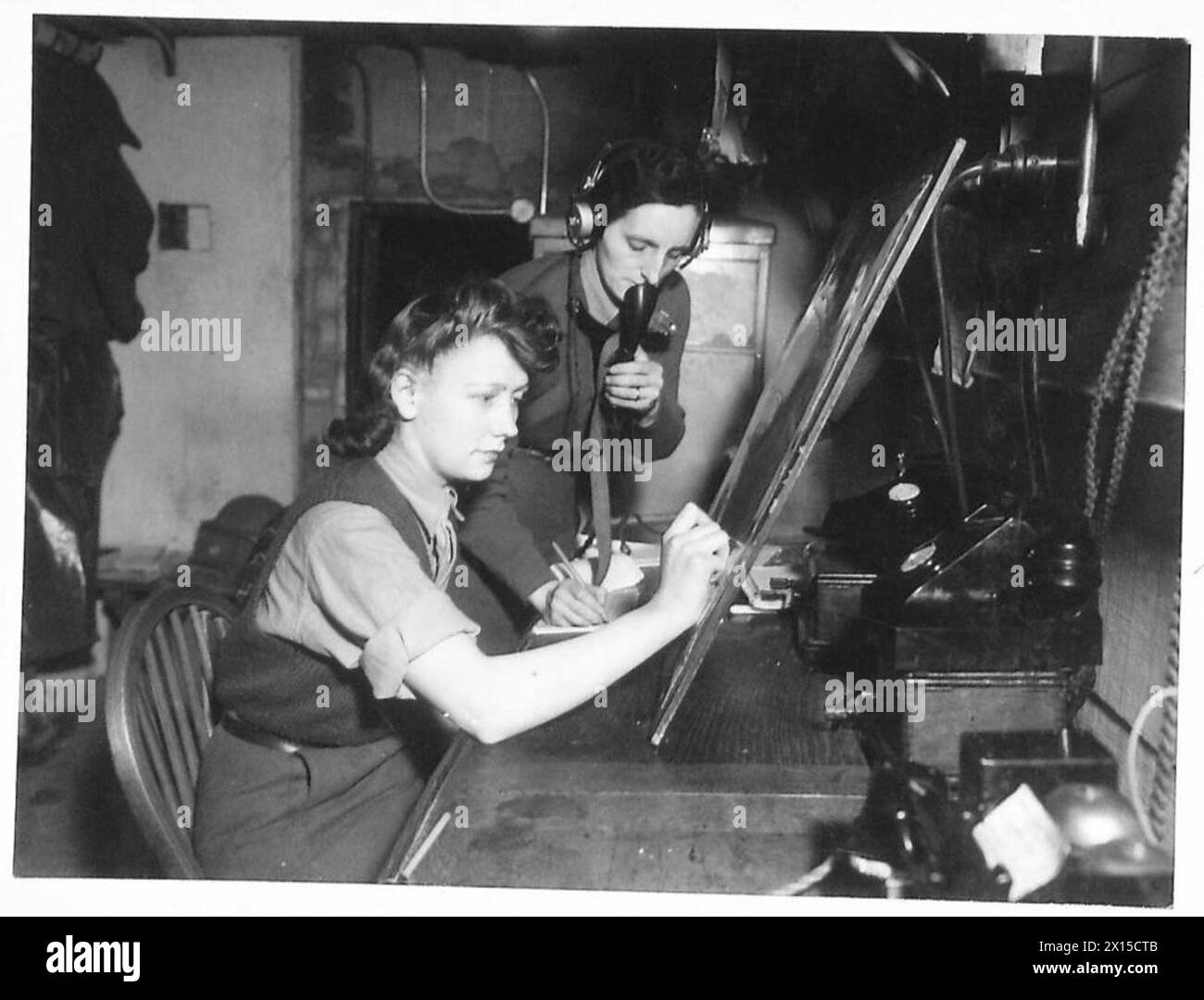 ATS anti-aircraft personnel plot the approach of enemy aircraft during ...