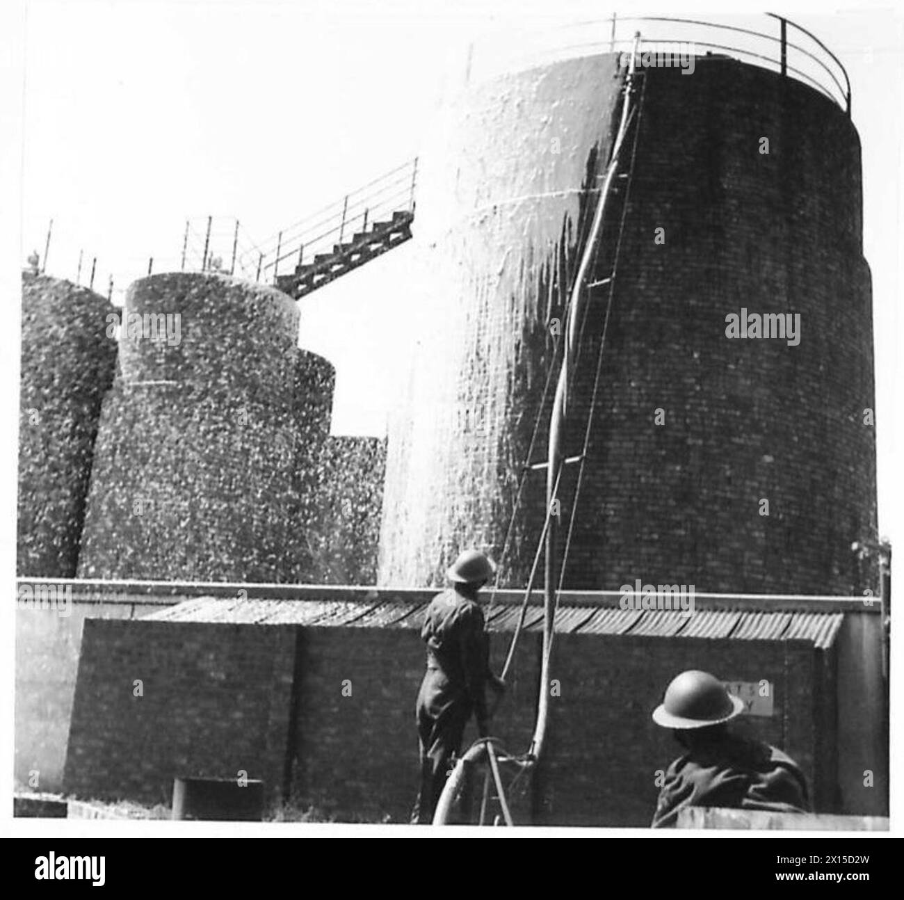 ARMY FIREMEN - The hoses are all connected up, the branch is hauled ...