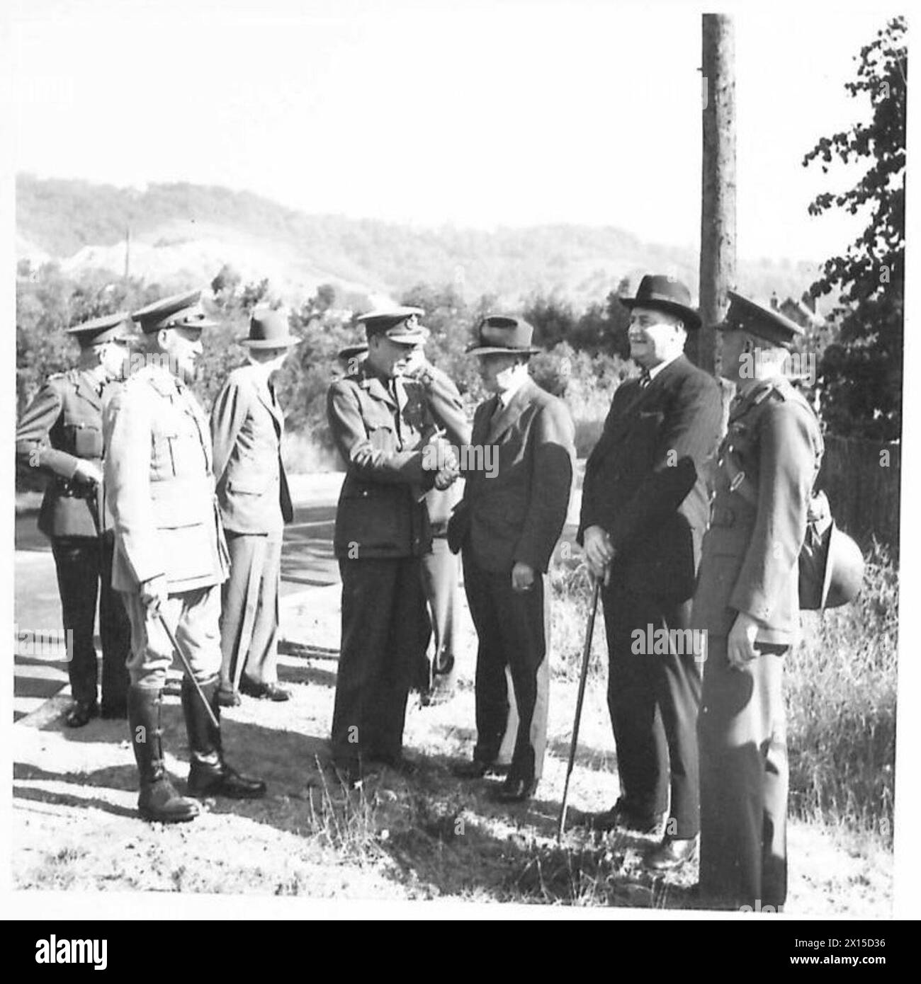 Canadian Ministers and Generals observe Canadian troops during an official visit, with Mr. Power ...