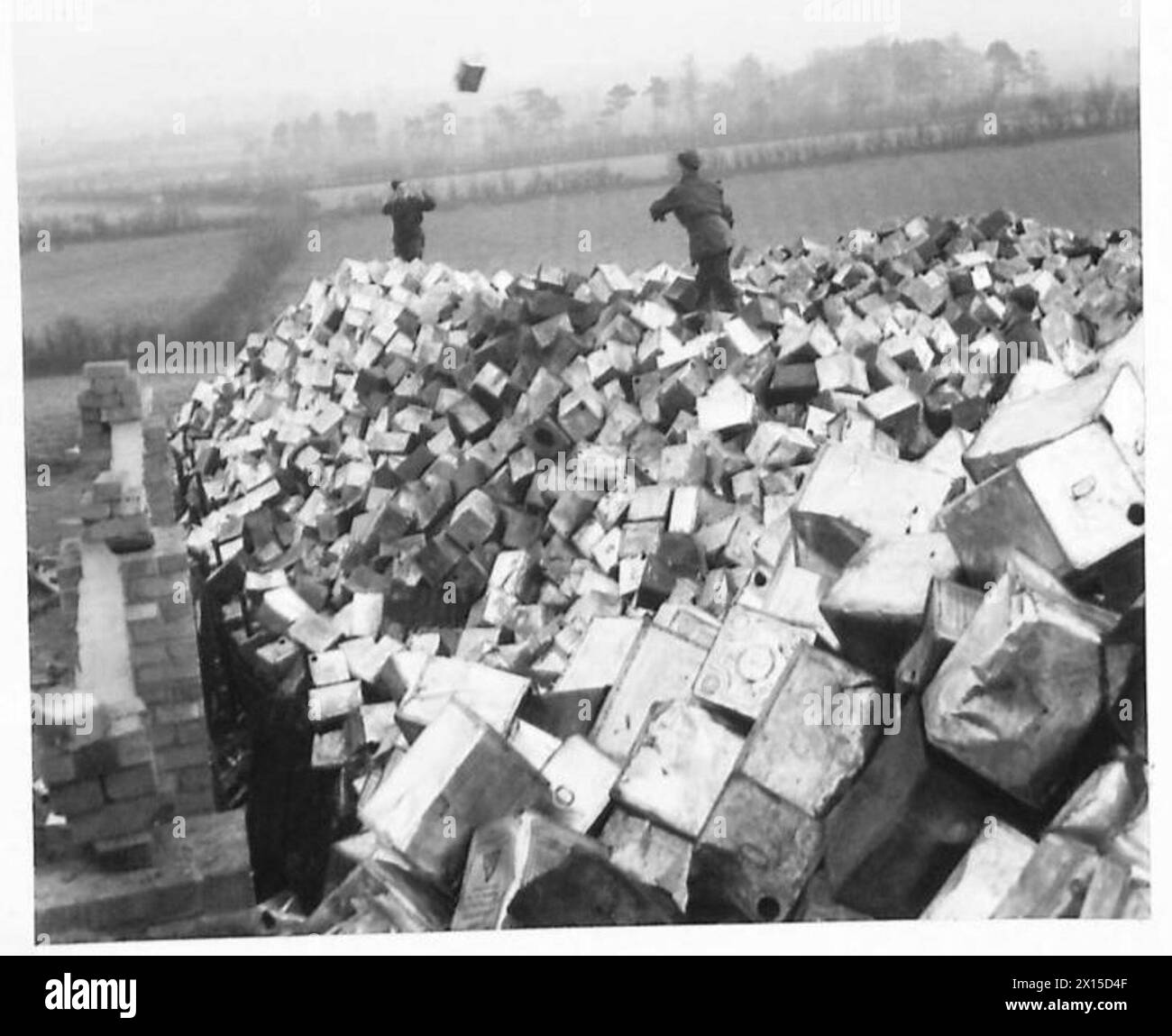 ARMY SALVAGE - A huge dump of petrol cans ready to be dealt with ...