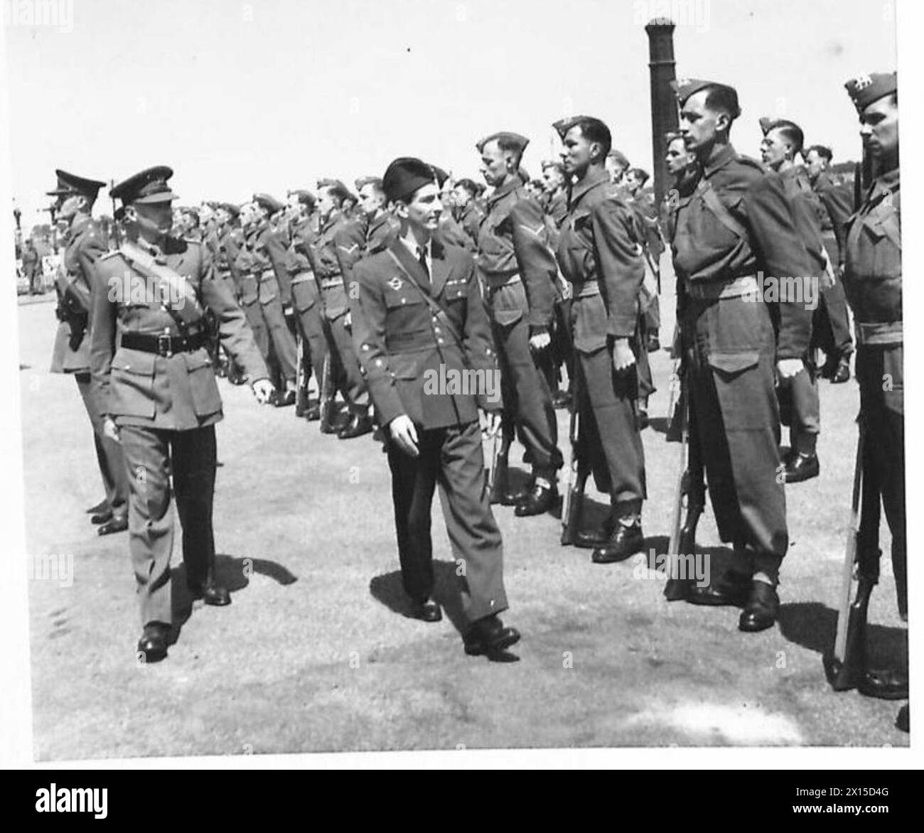 King Peter inspects a guard of honour of a battalion of the Queen's ...