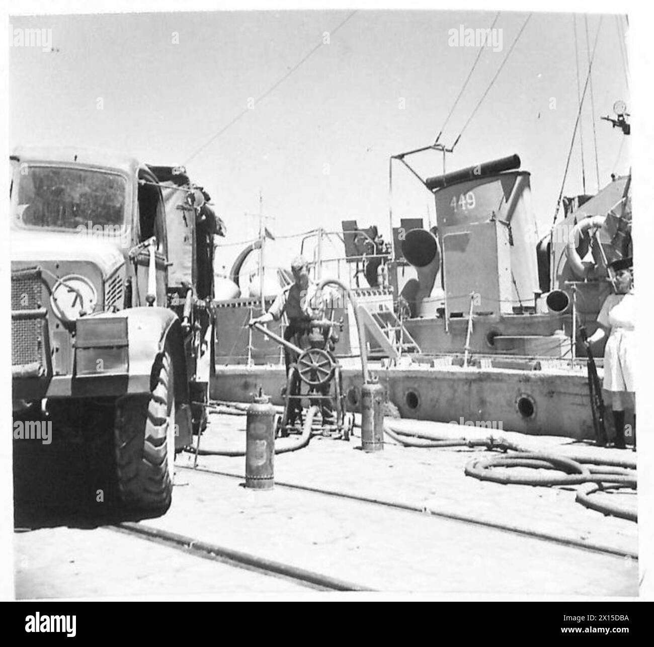 Fuel is distributed to a motor ship from a fuel transporter as part of ...
