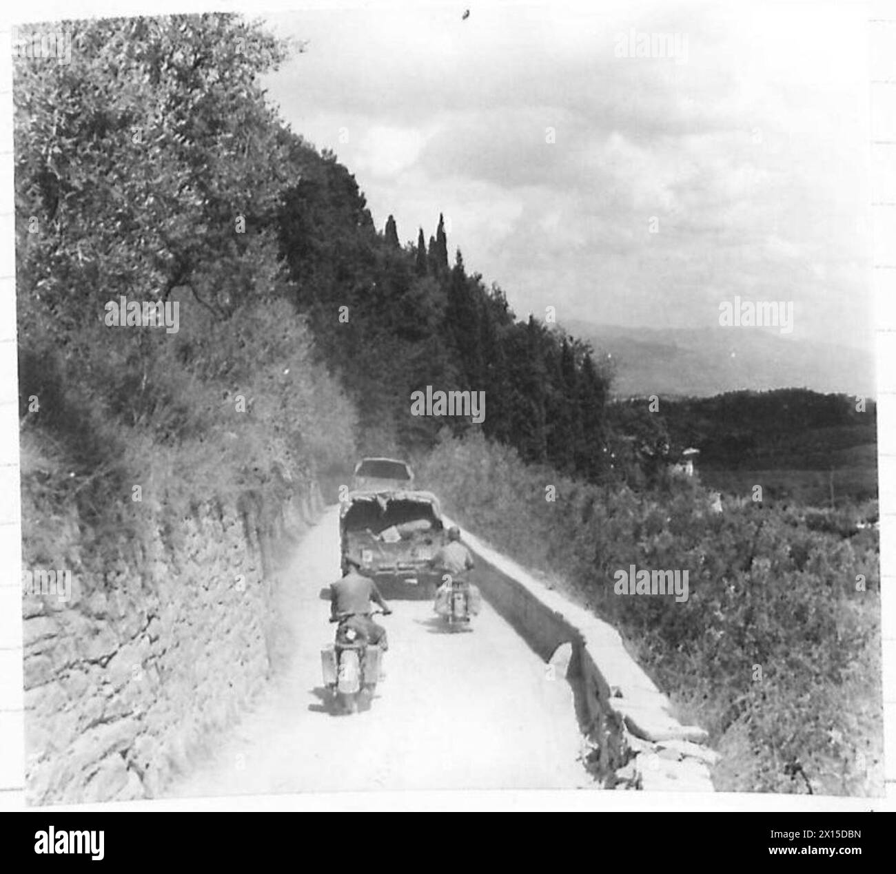 EIGHTH ARMY : VARIOUS - Vehicles of all types move along the dusty ...