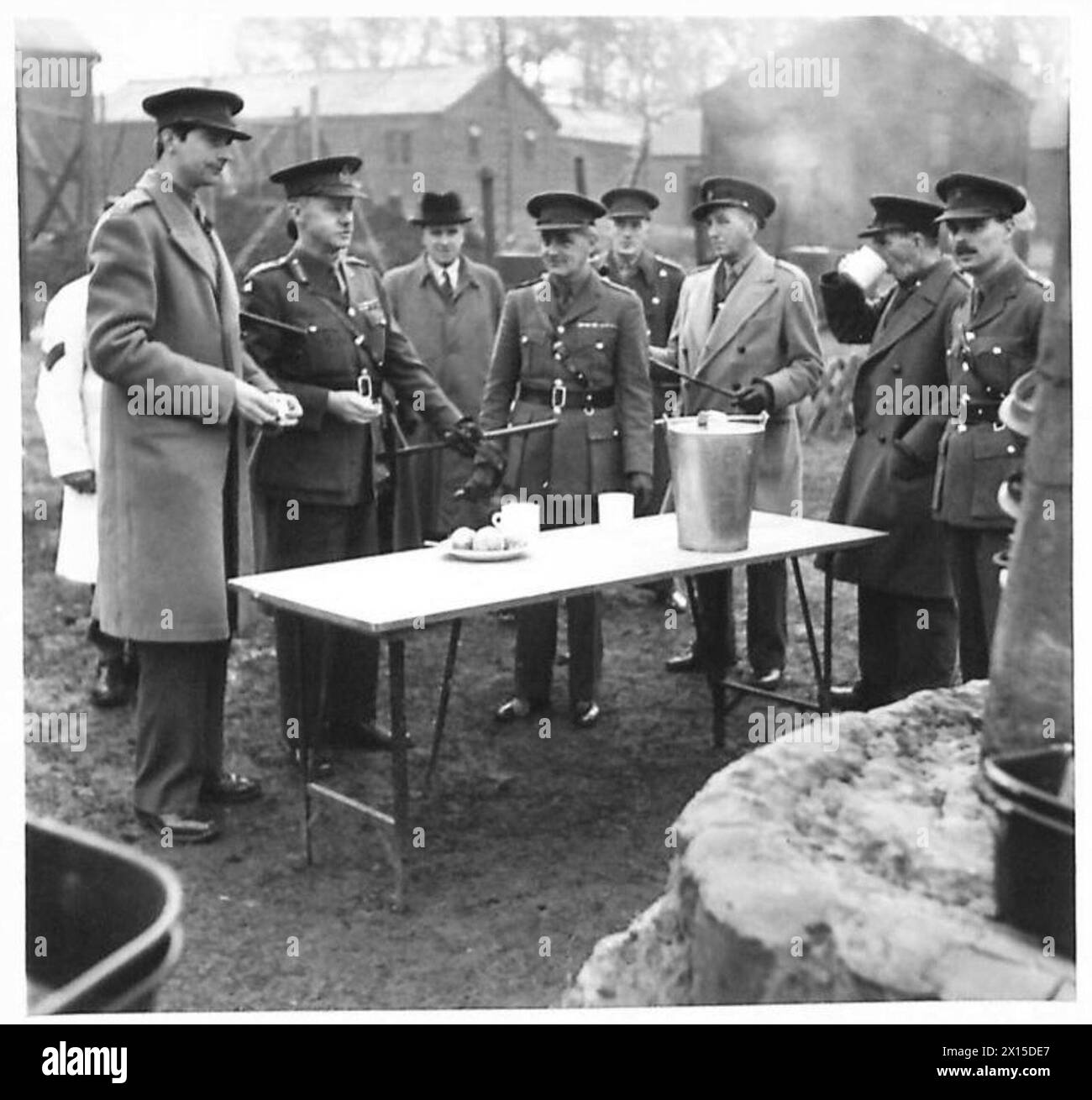 Major General K.J. Martin, DSO, and officers observe the storage and ...