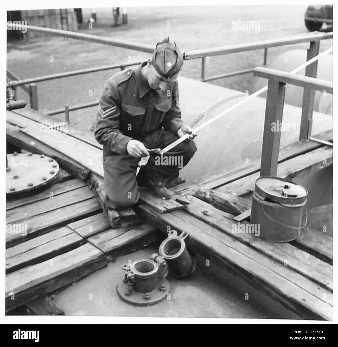 BASE PETROL FILLING DEPOT - Litmus paste is smeared on the dip stick ...