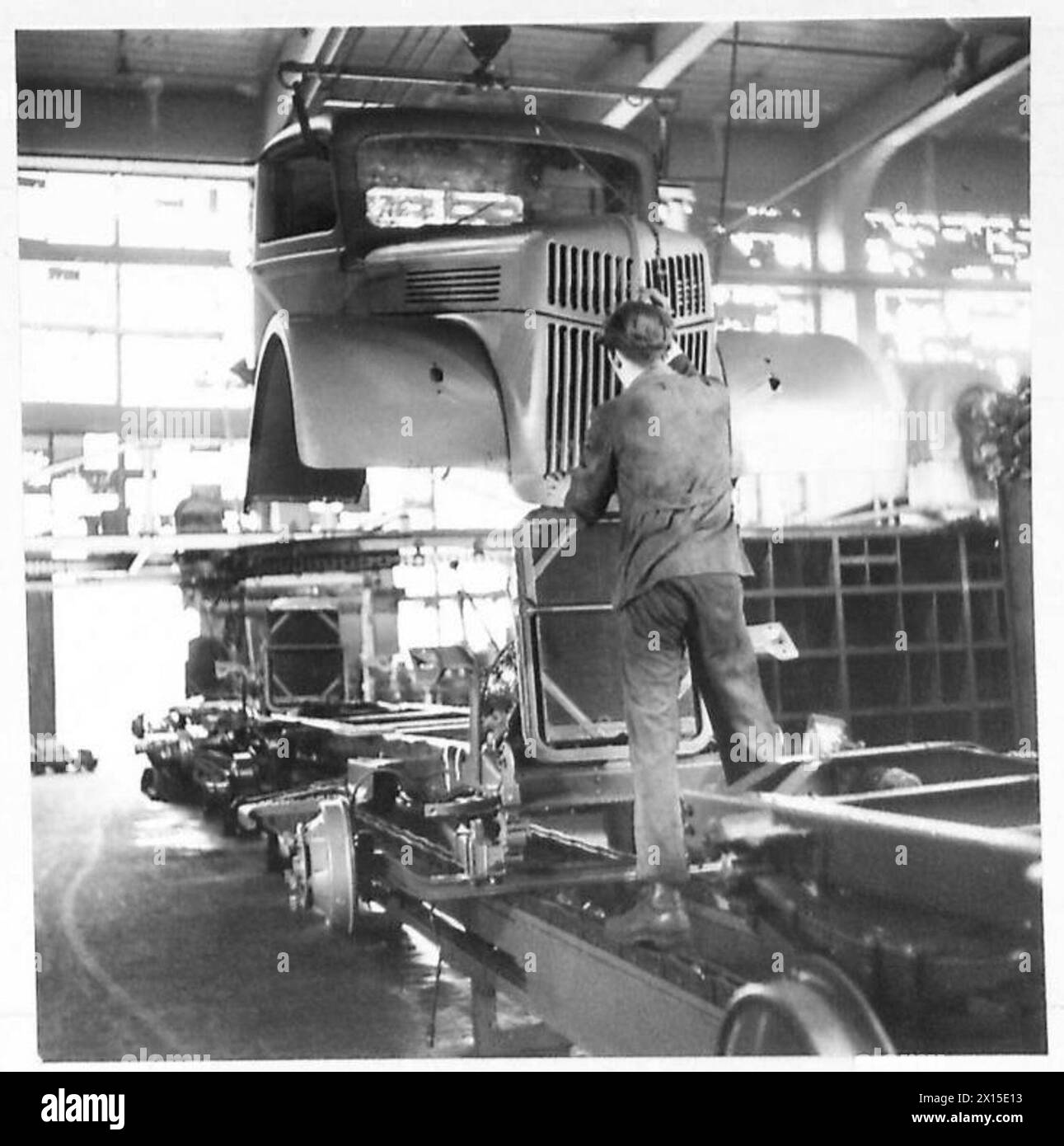 FORD WORKS AT COLOGNE - Completed driving cab is lowered onto the ...