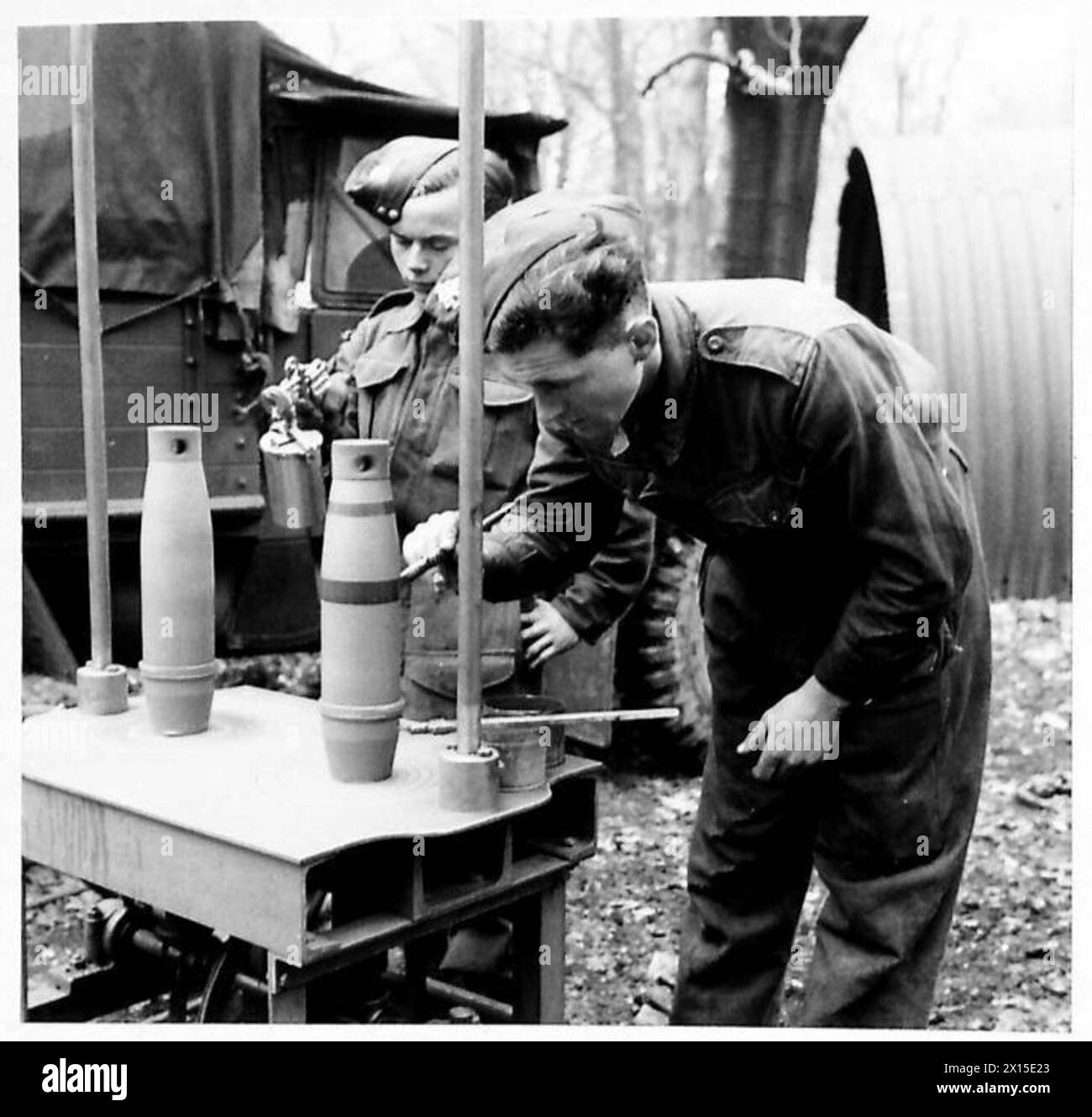 Shells are recoated on a turntable at an ammunition repair centre ...