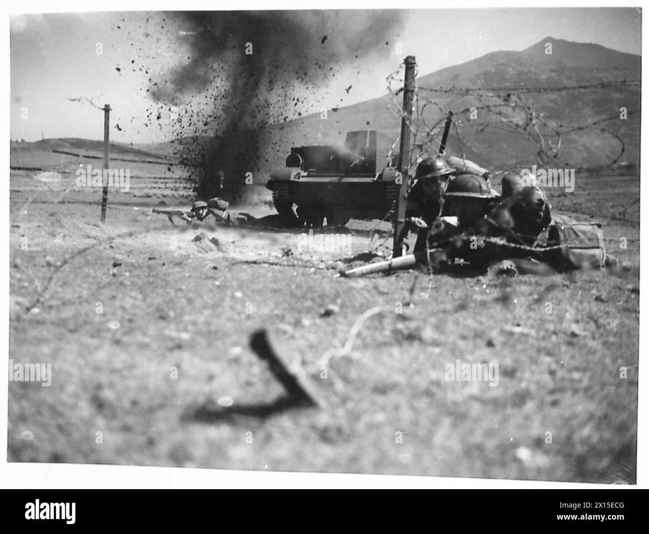 TOUGHENING-UP AT A BATTLE SCHOOL - A wire cutting party clearing the ...