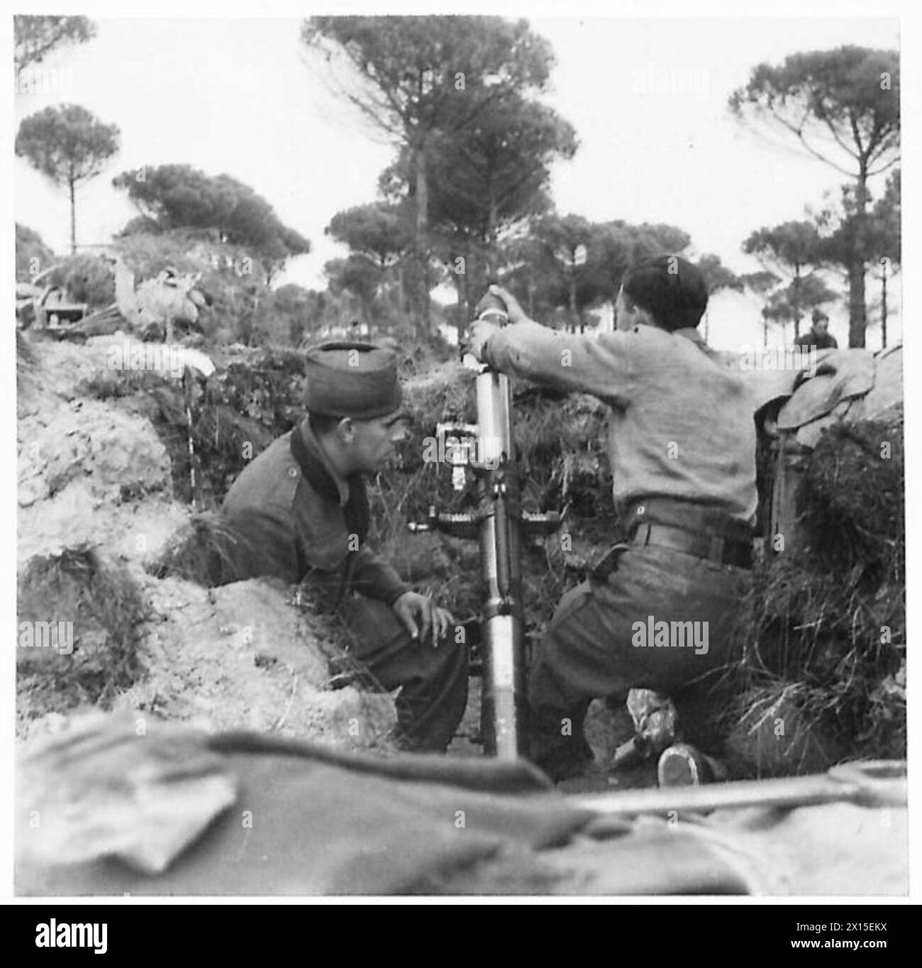 MORTARS IN ACTION - A mortar crew of the Royal Marine Commando load a ...