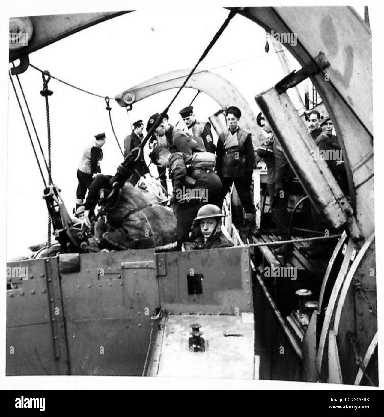 British Army troops board boats from the deck of a raiding ship during ...