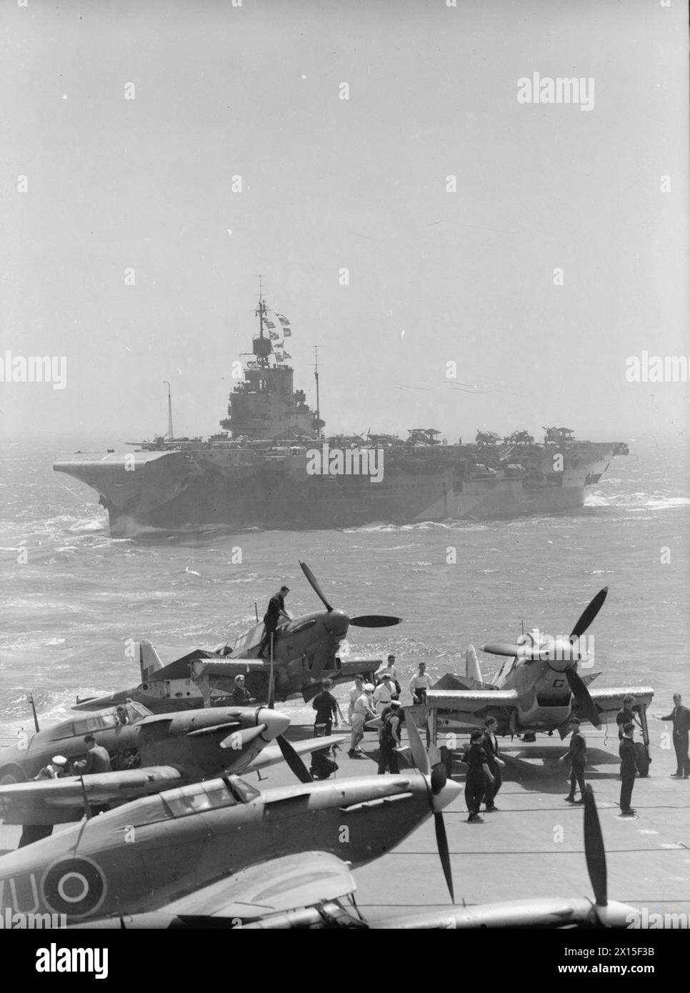 THE BRITISH AIRCRAFT CARRIER INDOMITABLE. MALTA CONVOY AUGUST 1942 ABOARD HMS VICTORIOUS. THE ...