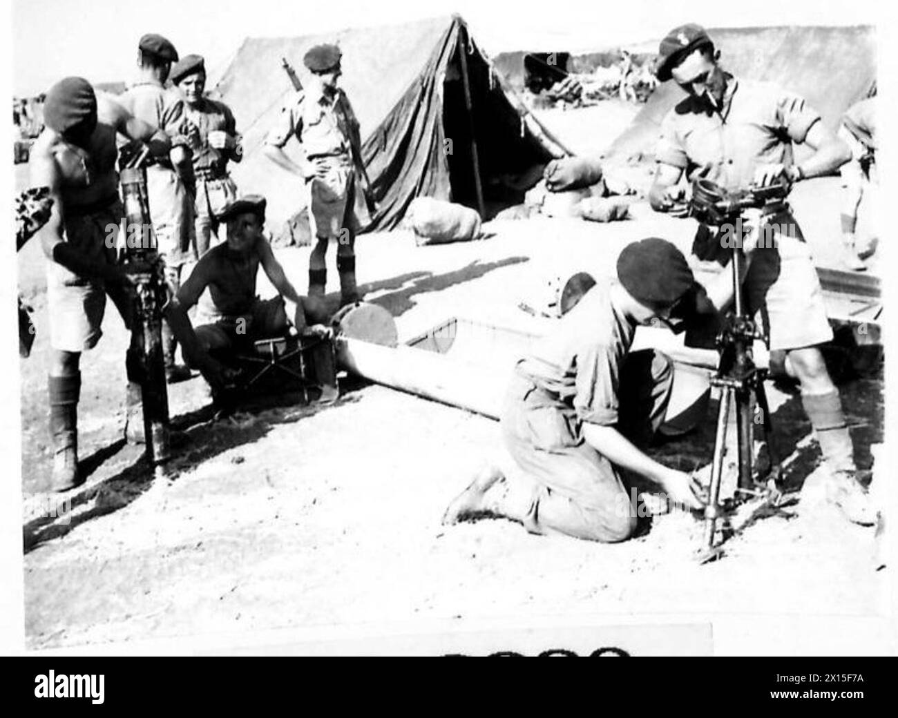 PREPARING FOR A PARATROOP EXERCISE - Preparing a 3-inch mortar for ...