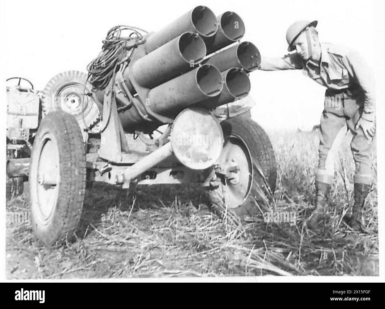 A German 6-inch mortar with six barrels on a two-wheeled chassis is ...