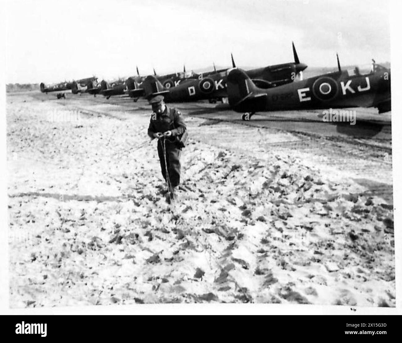 Air Formation Signals personnel work to repair a broken line at a ...